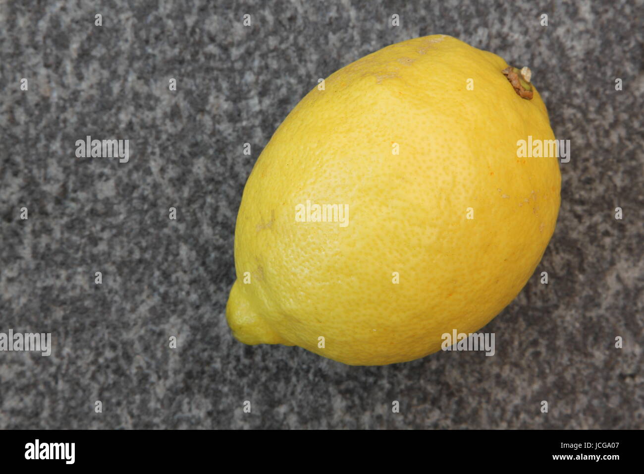 Lemon on Stone background Stock Photo - Alamy