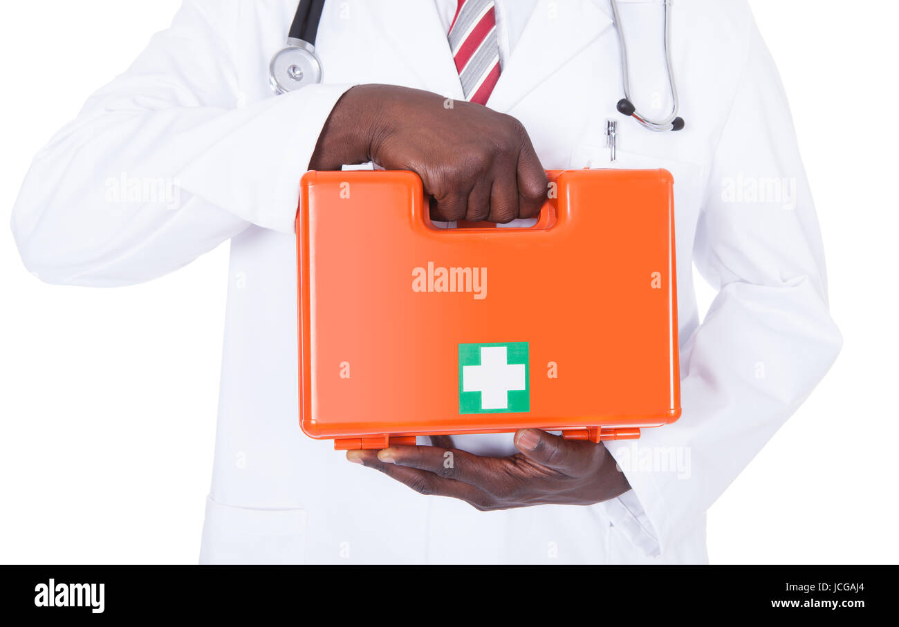 Young Male African Doctor Holding First Aid Box Over White Background ...