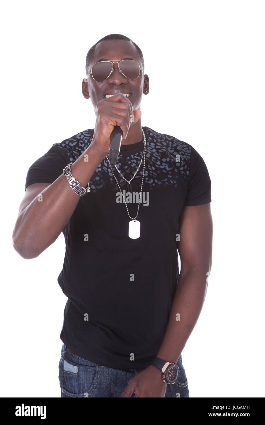 Portrait Of Male African Singer Singing Over Black Background Stock ...