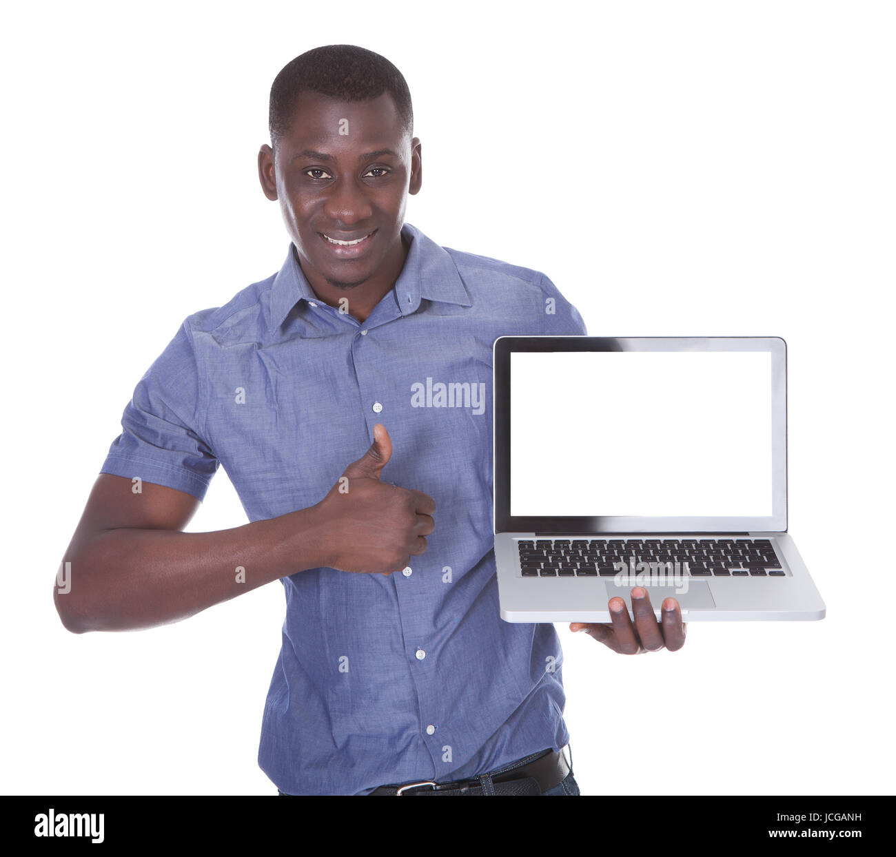 Portrait Of African Man Pointing Towards Laptop Over White Background ...