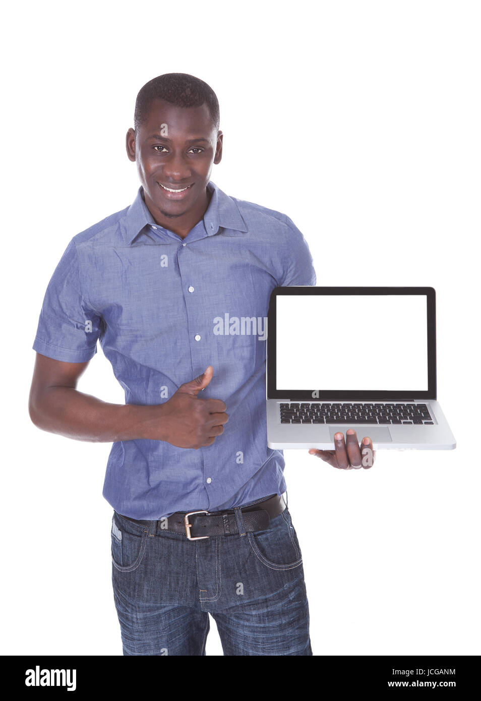 Portrait Of African Man Pointing Towards Laptop Over White Background ...