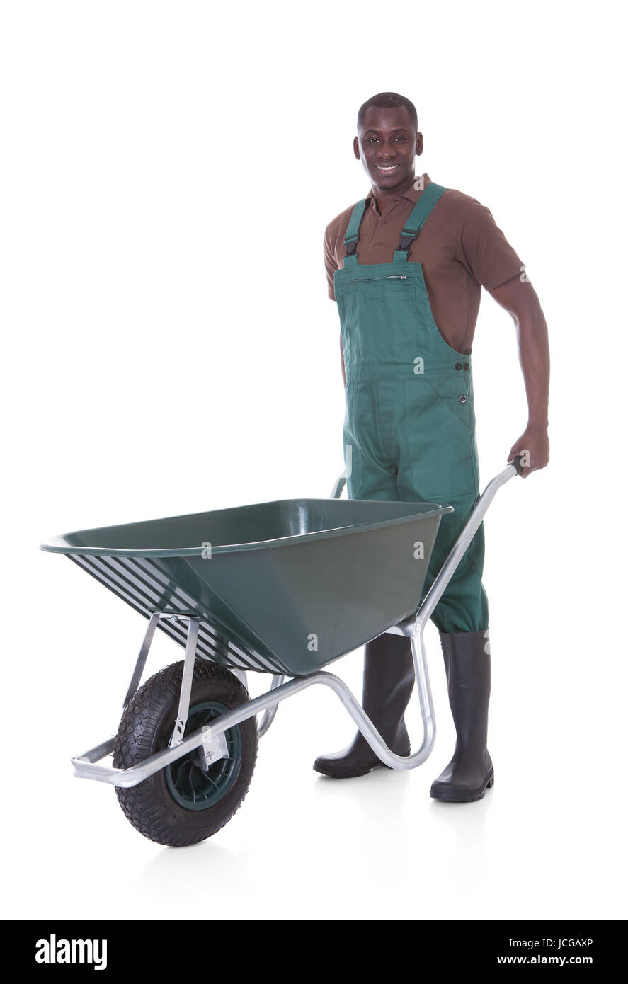 Happy Male Gardener Holding Wheelbarrow Over White Background Stock ...