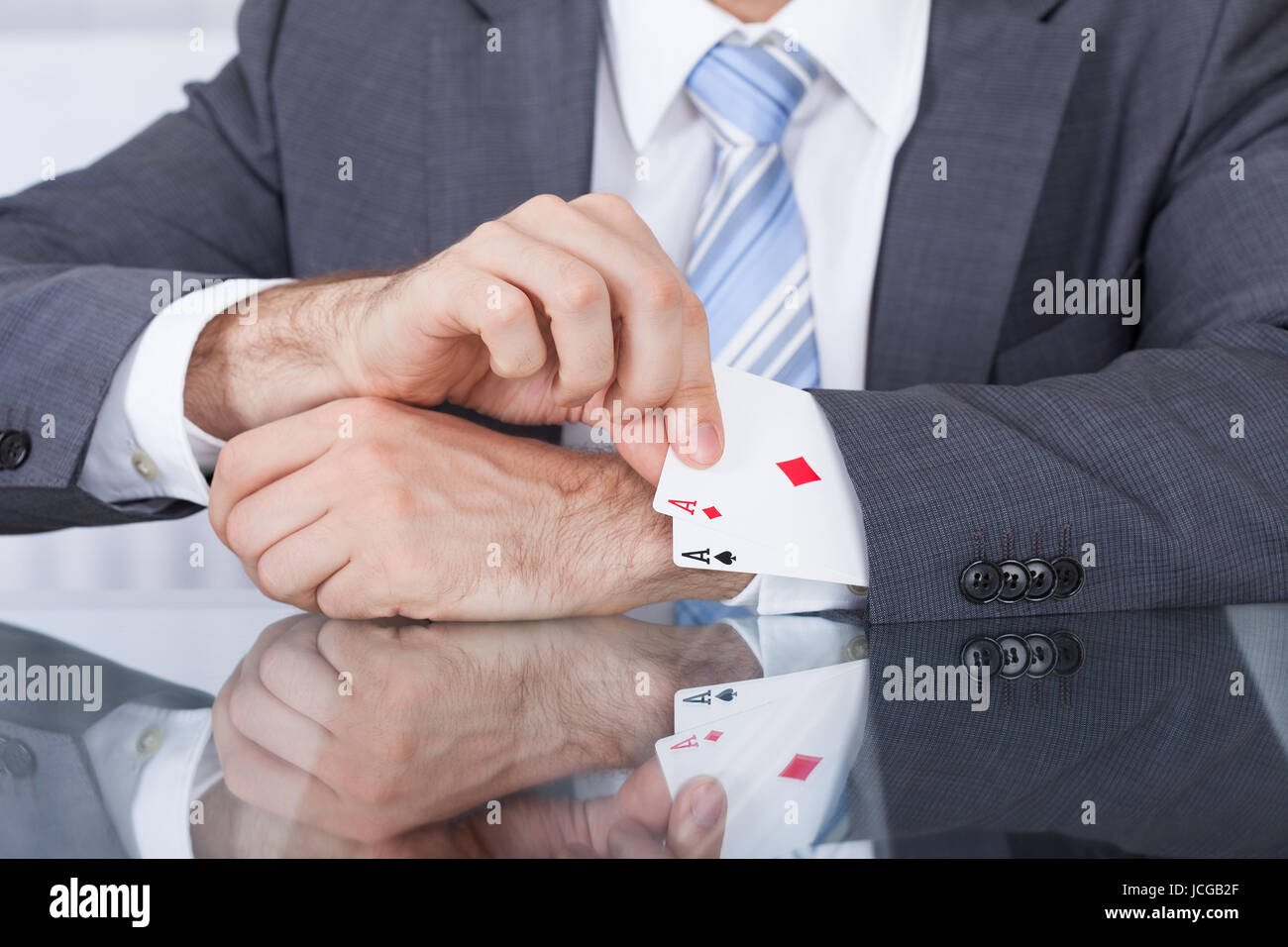 Playing cards ace hand sleeve hi-res stock photography and images - Alamy