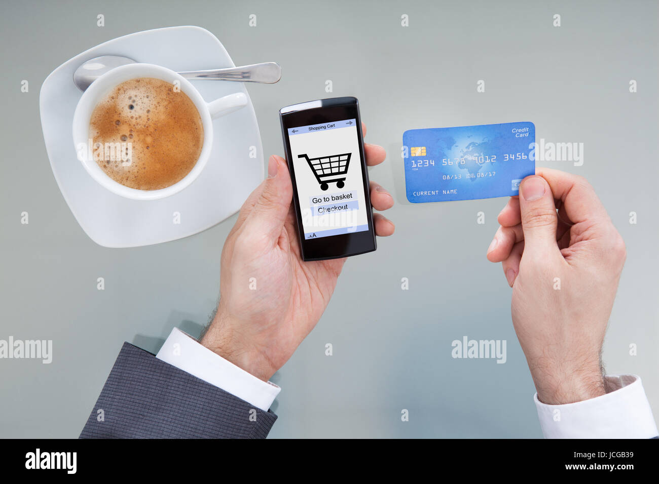 Close-up Of Businessperson Hand Holding Mobile Phone With Online ...