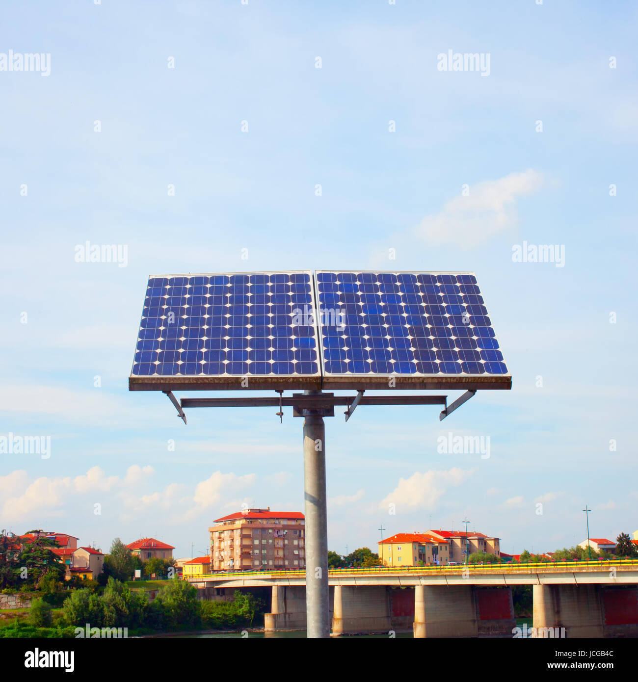 Solar panel in plain air, with town on the background Stock Photo - Alamy
