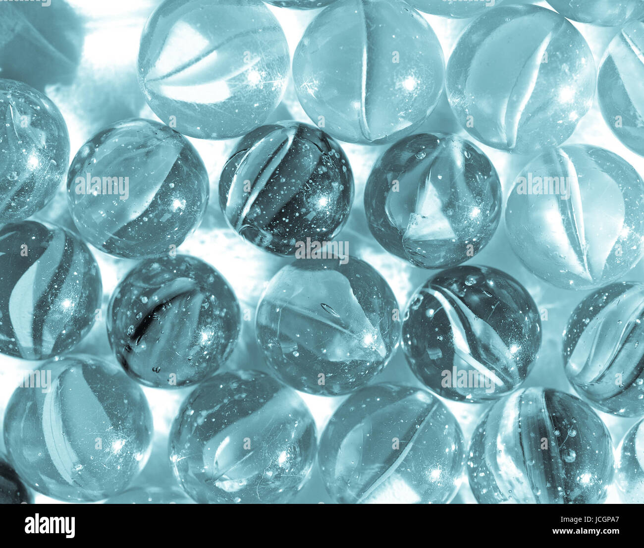 Coloured glass marble spheres toy background pattern - cool cyanotype ...