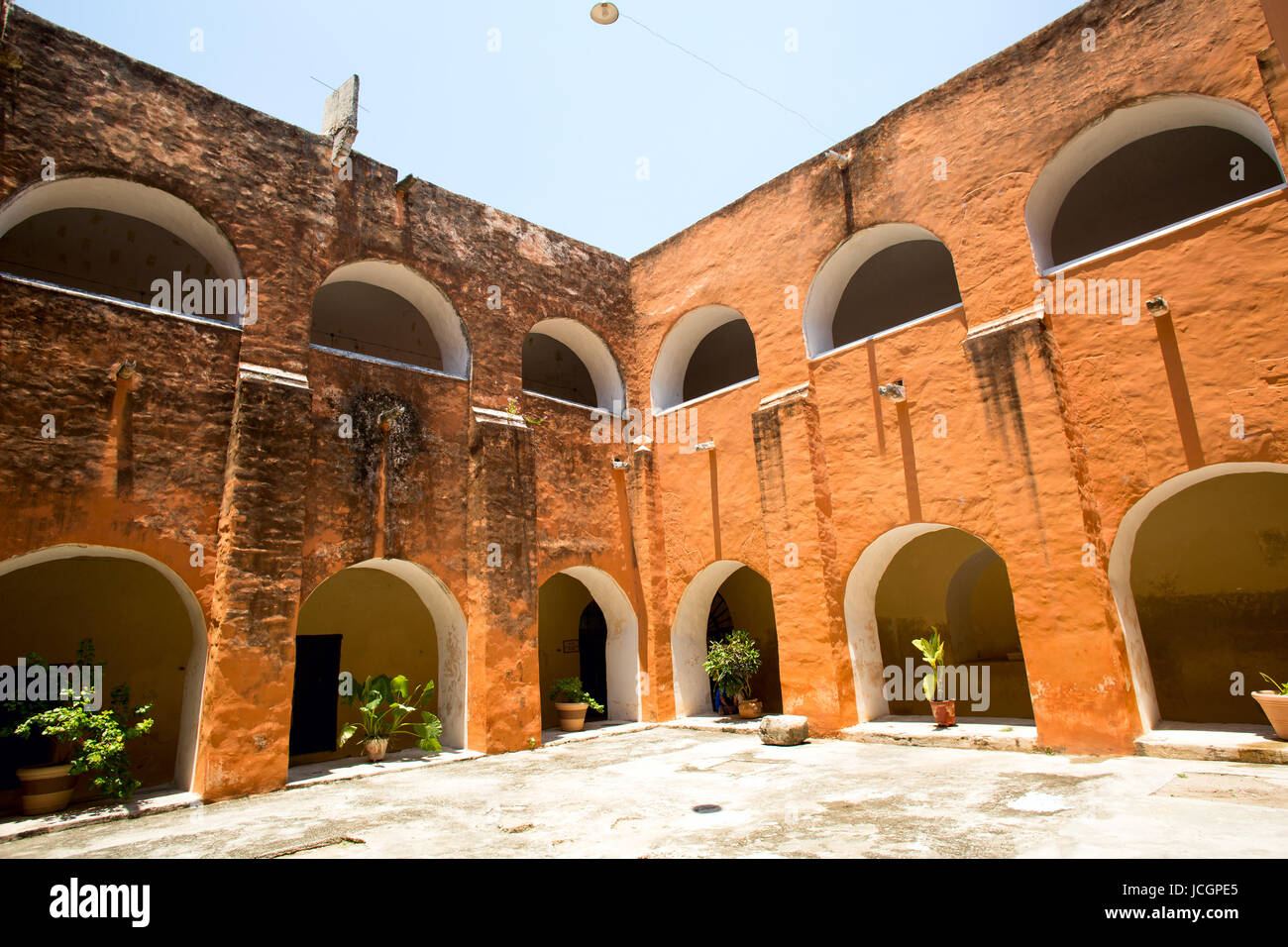 Medieval Spanish courtyard with arched windows and passage Stock Photo ...
