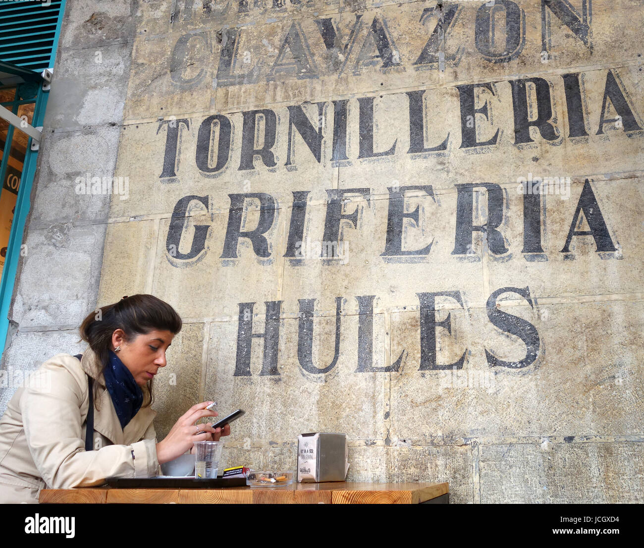 Woman smoking cigarette outside cafe bar in Santander Spain Stock Photo ...