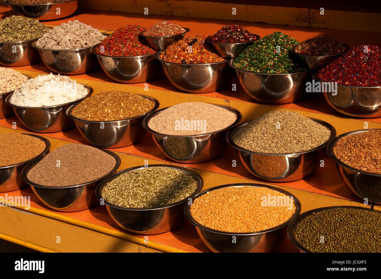 Bowls of nuts, pulses and spices on a market stall in Ahmadabad ...