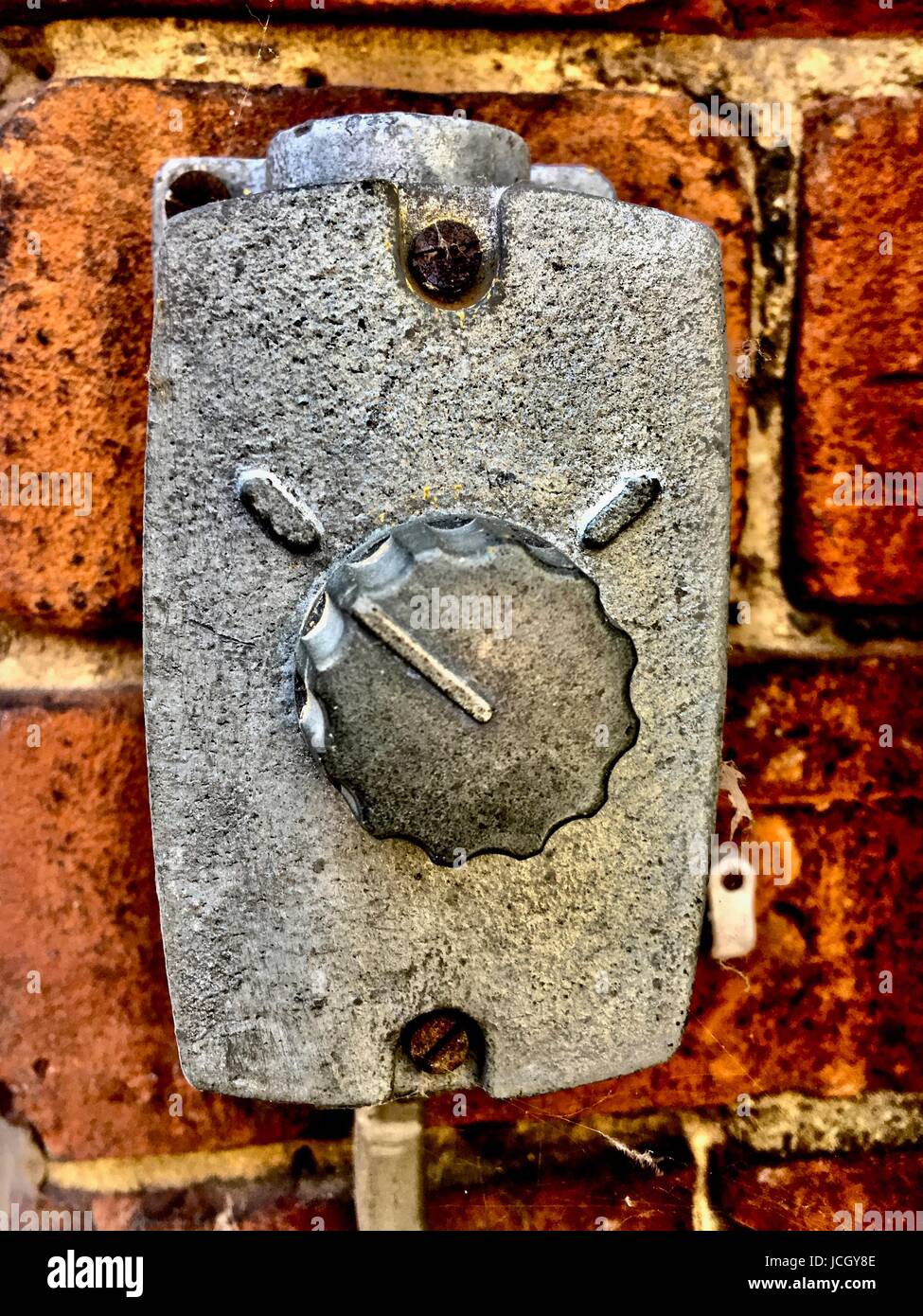 Very old metal switch on the brick old wall in england Stock Photo - Alamy