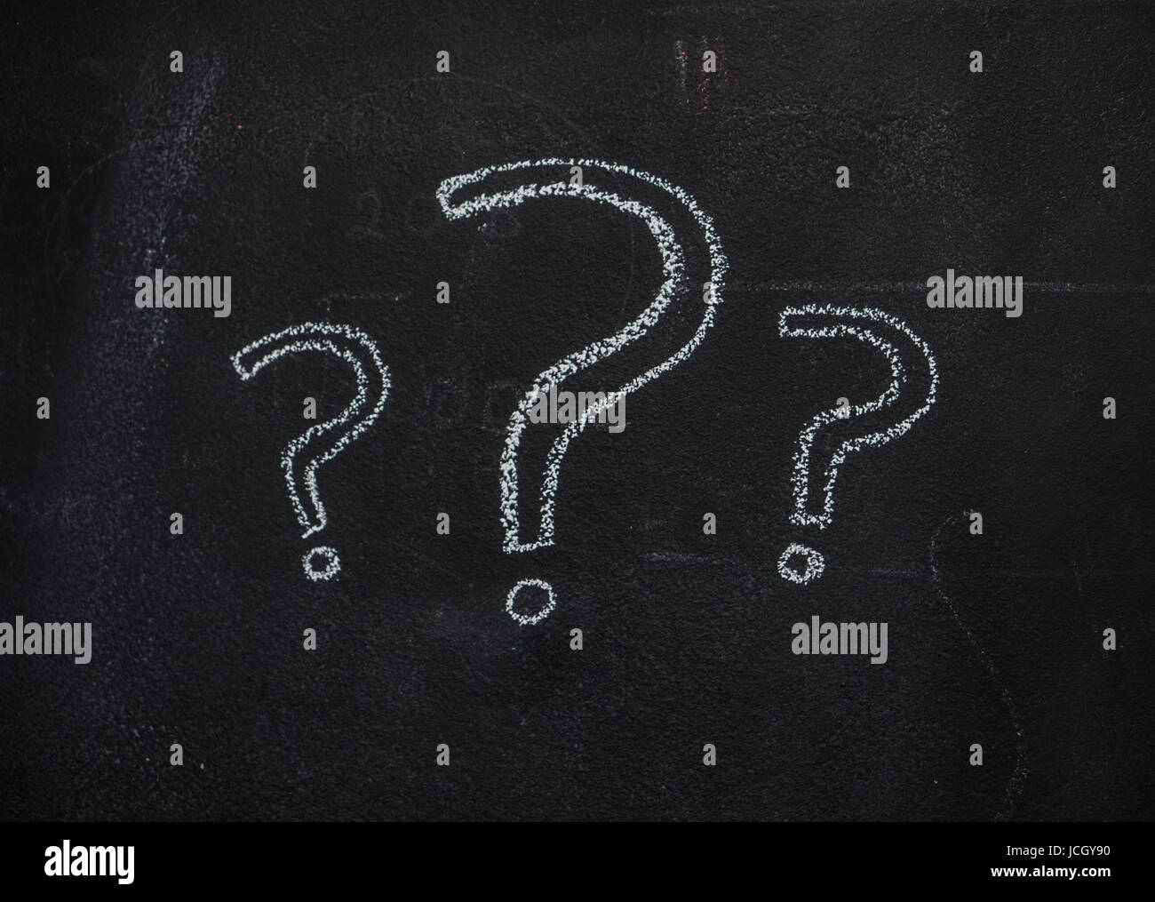 Three white question mark drawn with chalk on blackboard Stock Photo ...