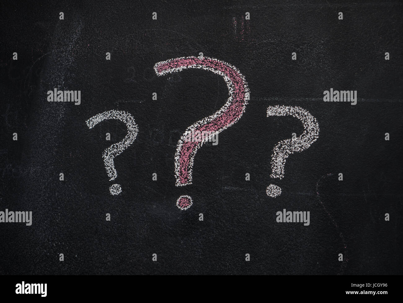 Three white and red question mark drawn with chalk on blackboard Stock ...