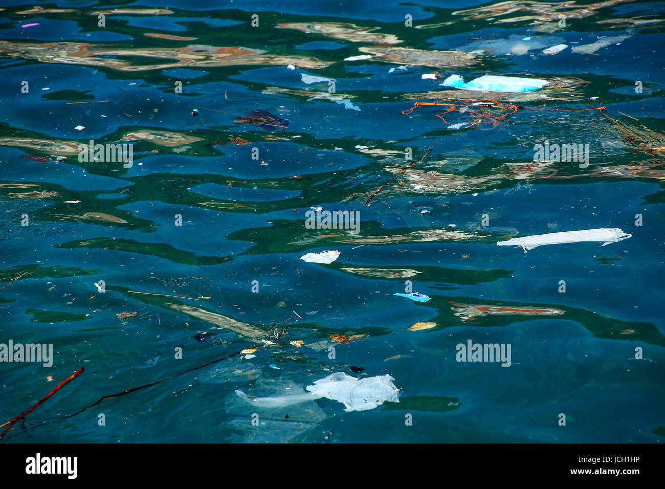 Garbage floating in a sea - water pollution Stock Photo - Alamy
