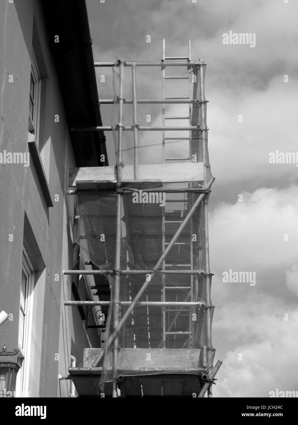 Scaffolding to residential building undergoing renovation work Stock ...
