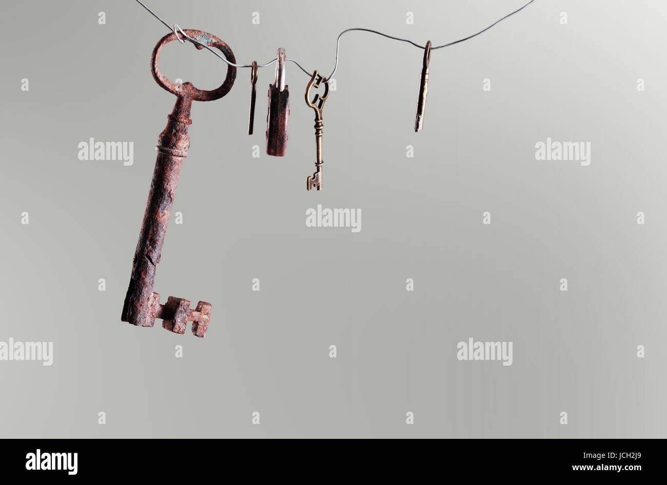 picture of an old keys on a grey background Stock Photo - Alamy