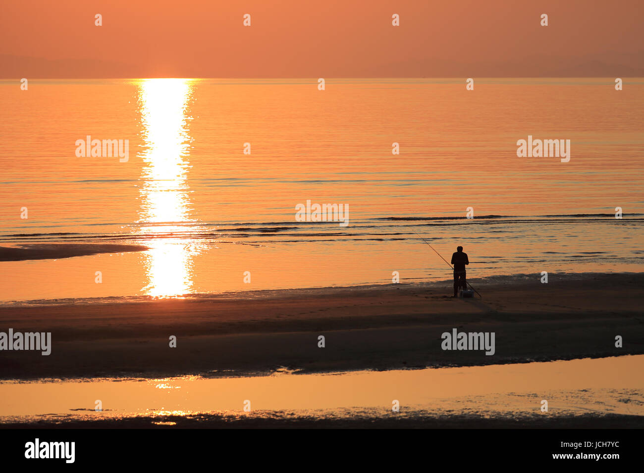 Beautiful sunset on the tropical beach and sea landscape with fisher ...