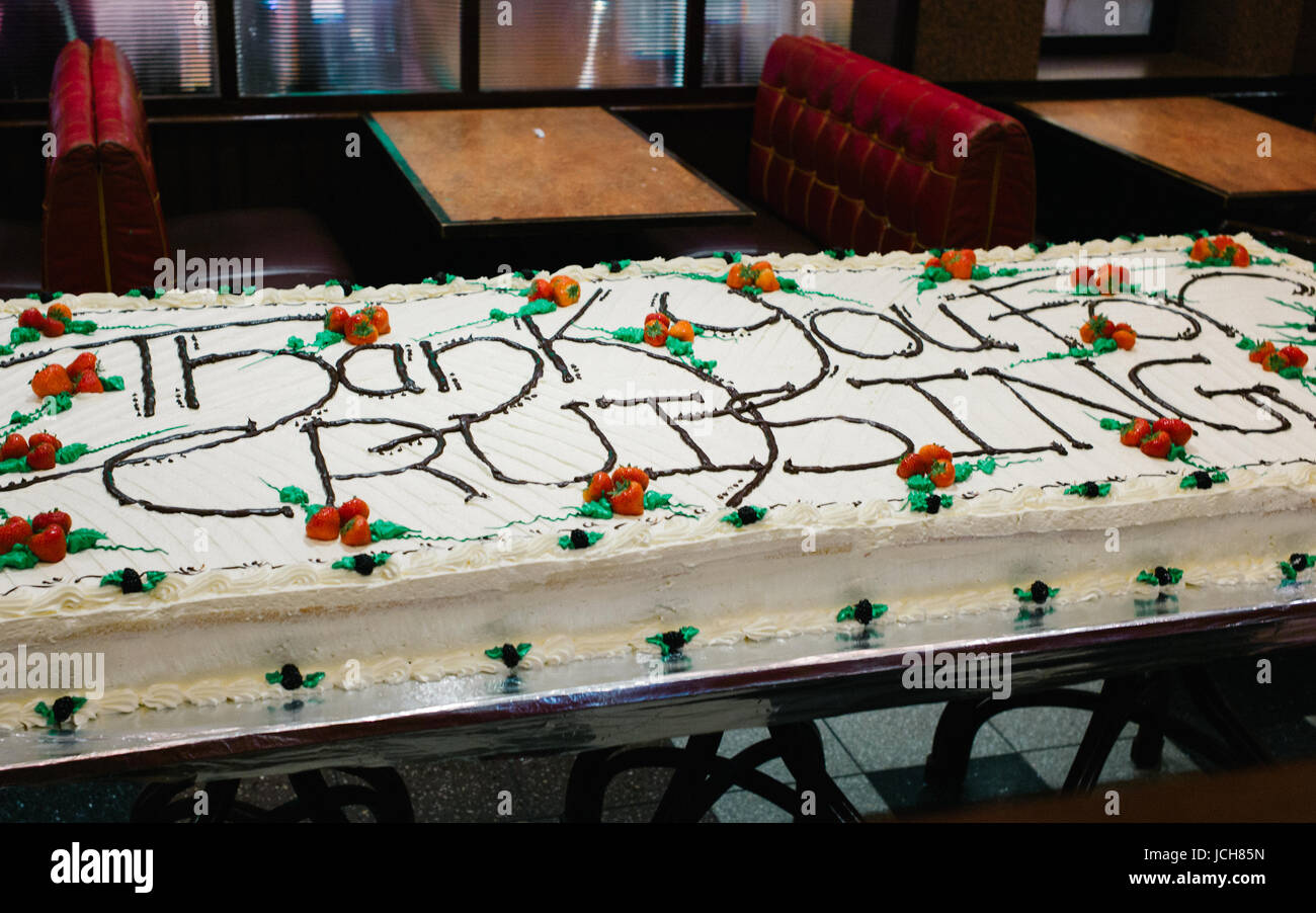 Very large cake saying thank you for crusing Stock Photo - Alamy