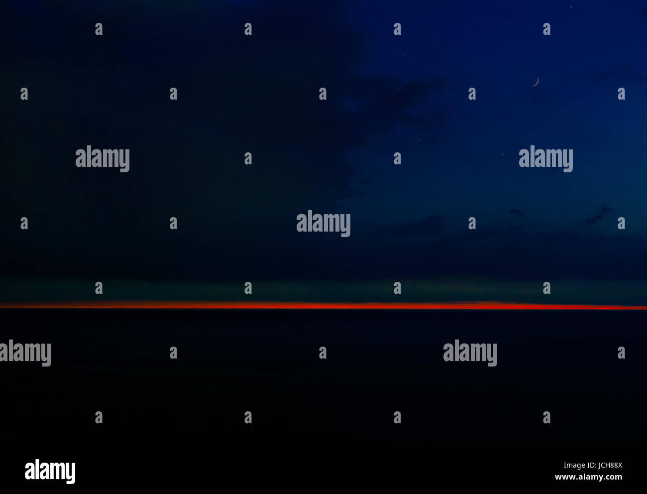 Suble sunset at sea with very calm sea Stock Photo - Alamy