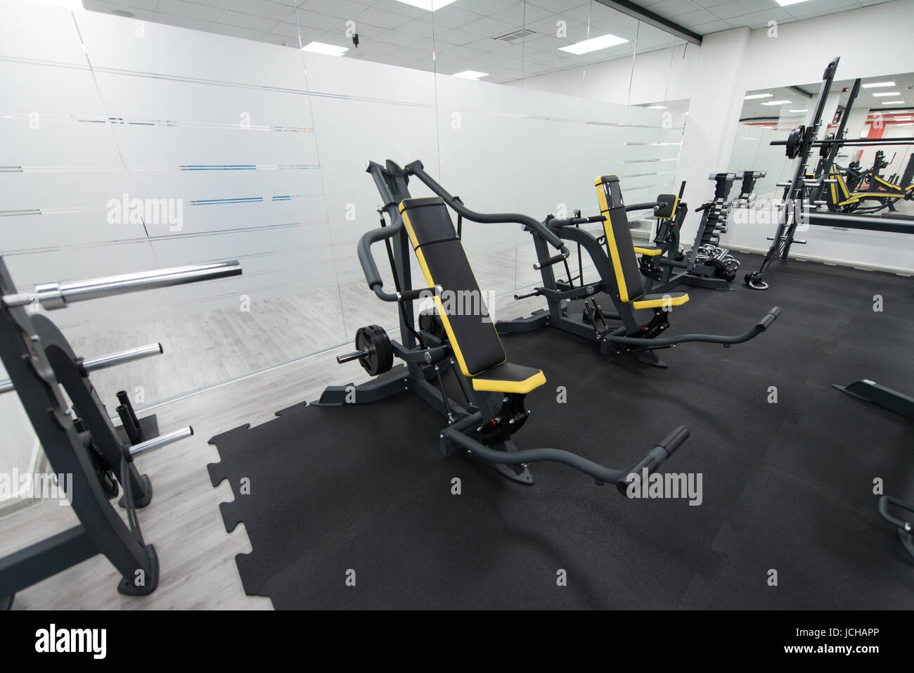 Modern Gym Room Fitness Center With Equipment And Machines Stock Photo ...