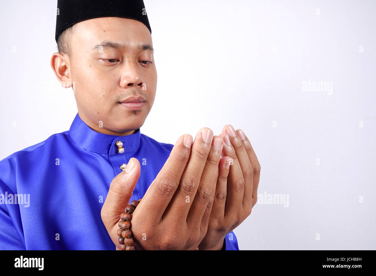 Muslim Praying with Tasbih Stock Photo - Alamy