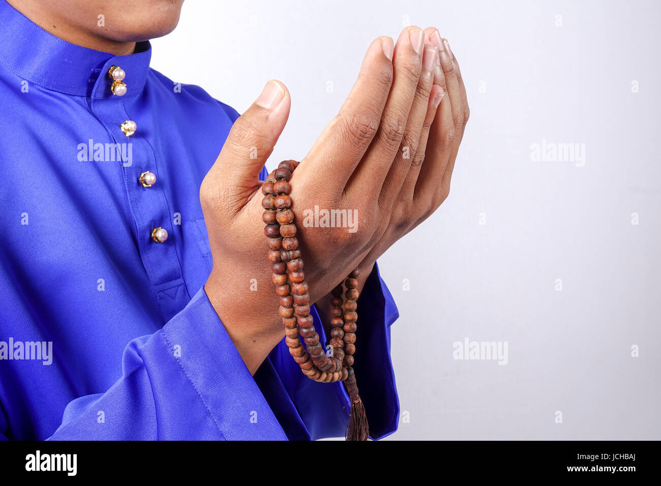 Muslim Praying with Tasbih Stock Photo - Alamy