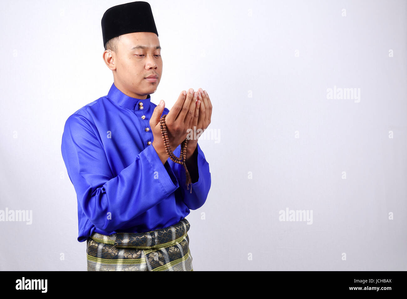 Muslim Praying with Tasbih Stock Photo - Alamy