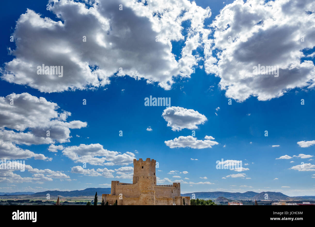 Ultra wide angle shot of Villena Castle, clouds and blue sky. Villena ...