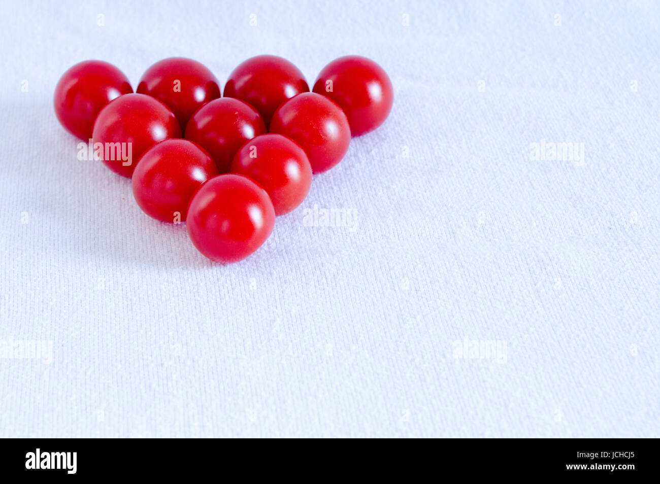 Cherry tomatoes in the form of a triangle Stock Photo - Alamy