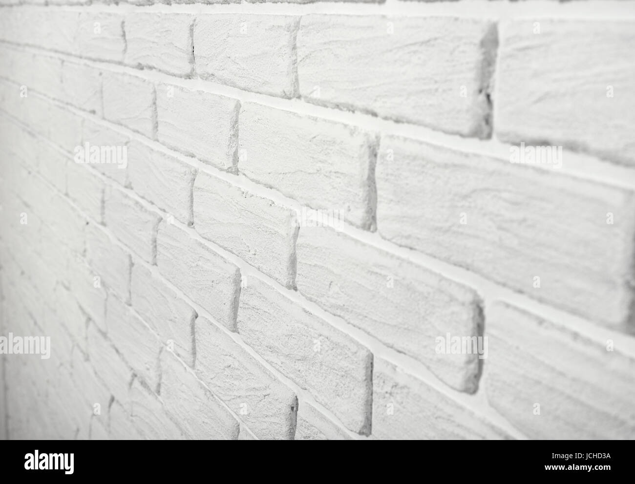 white brick wall, angle view, abstract background photo Stock Photo - Alamy