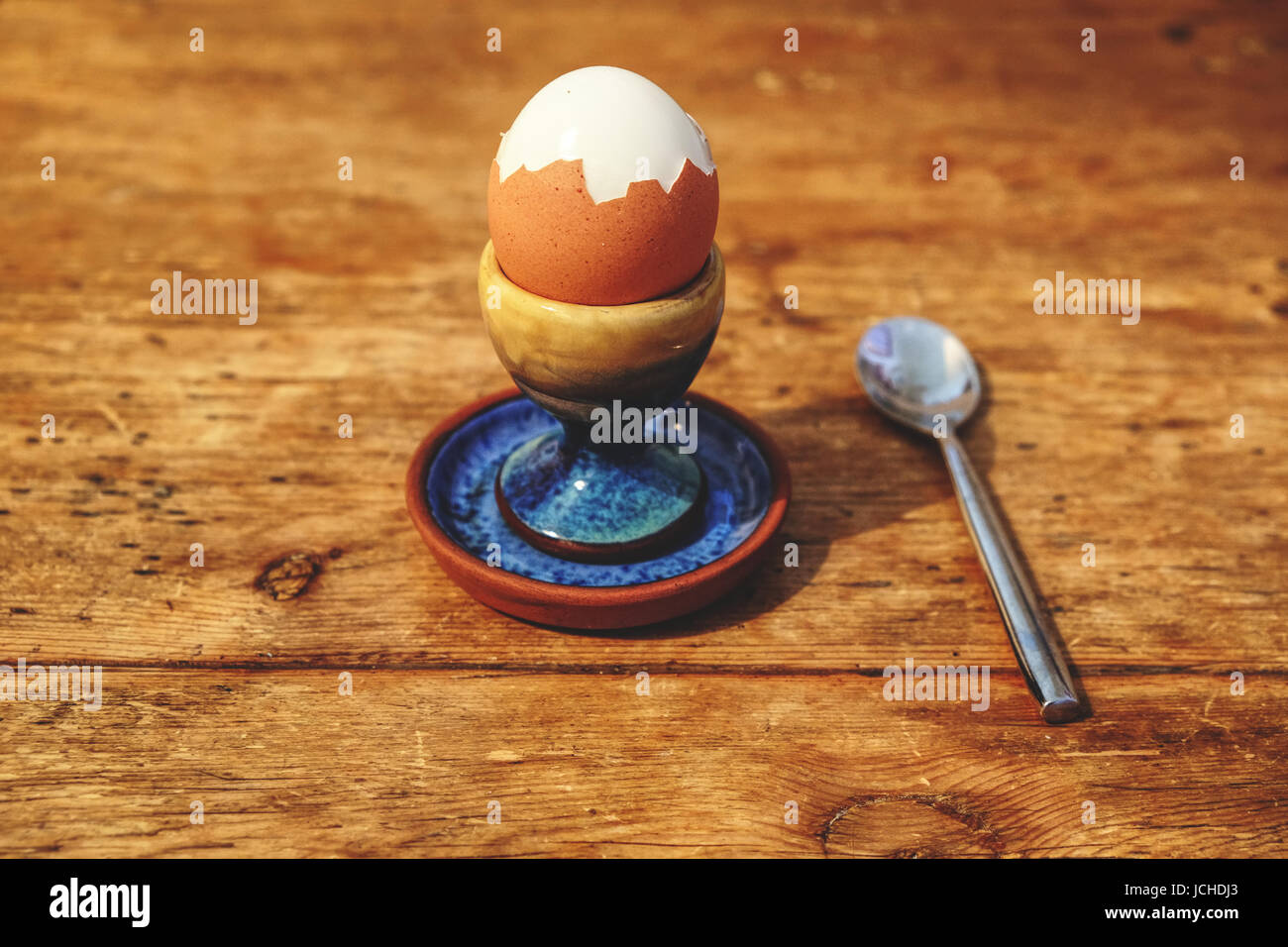 A boiled egg in a beautiful painted egg cup Stock Photo - Alamy