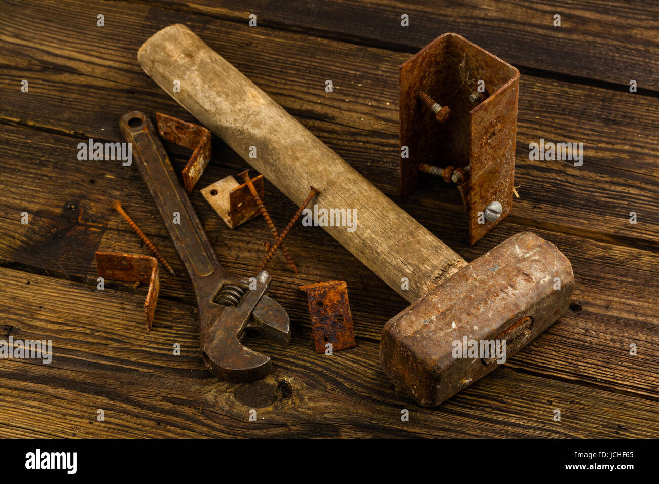 corner braces, screws, screwdriver, sledge hammer and adjustable wrench ...