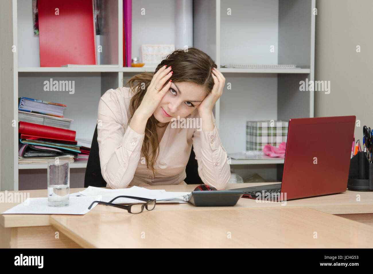 Young girl working at the desk in the office Stock Photo - Alamy