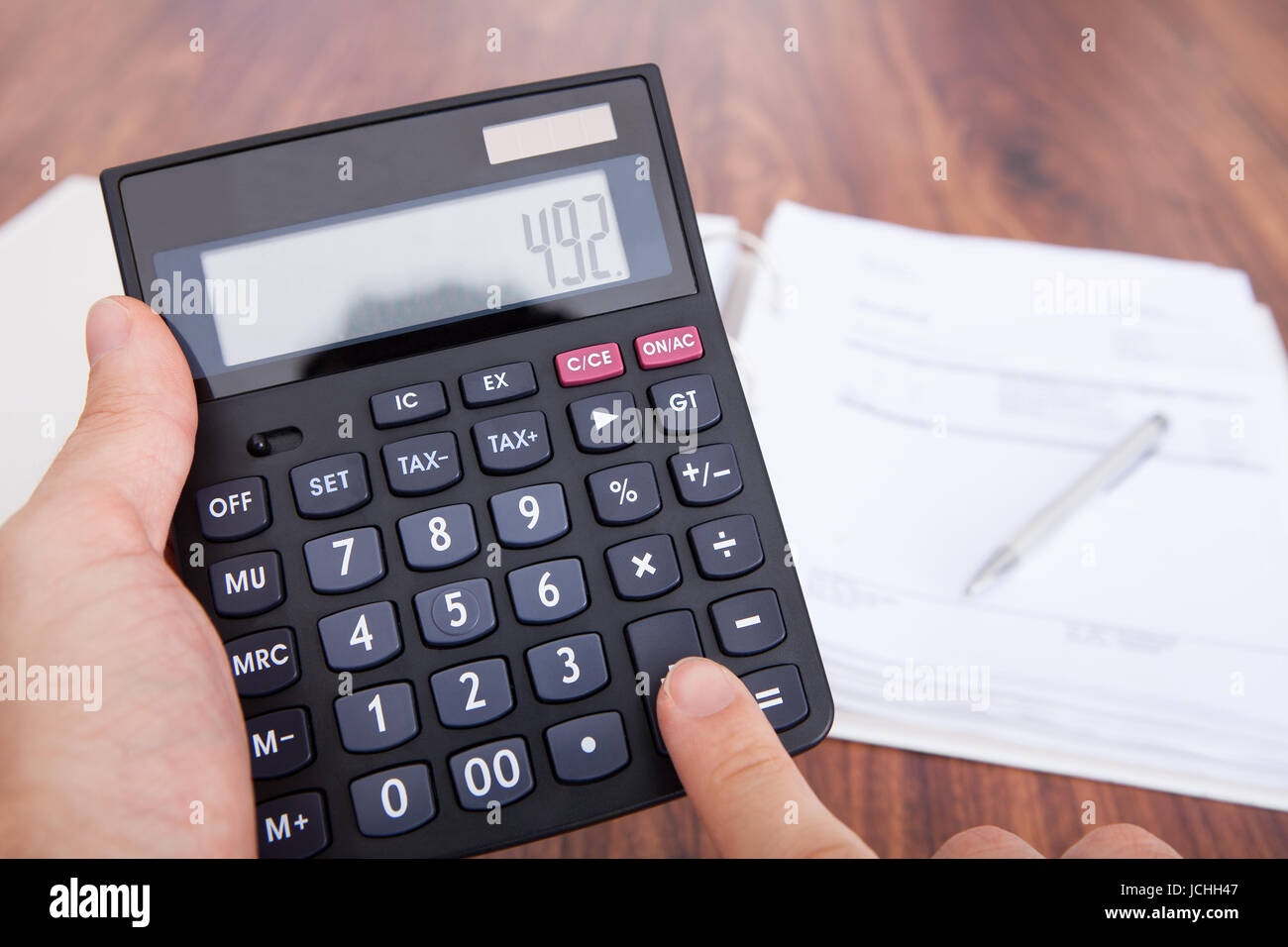 Calculation pay hand keyboard hi-res stock photography and images - Alamy