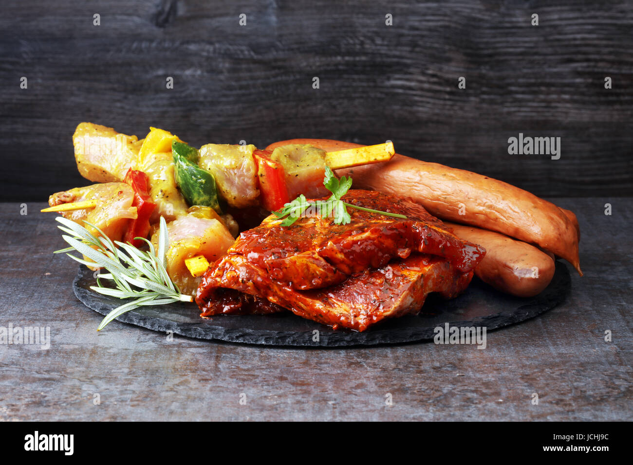 Selection of marinaded meat for bbq grilling on table Stock Photo - Alamy