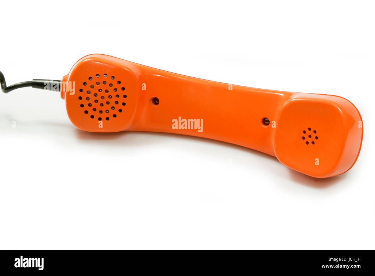 Old orange telephone tube isolated on white background Stock Photo - Alamy