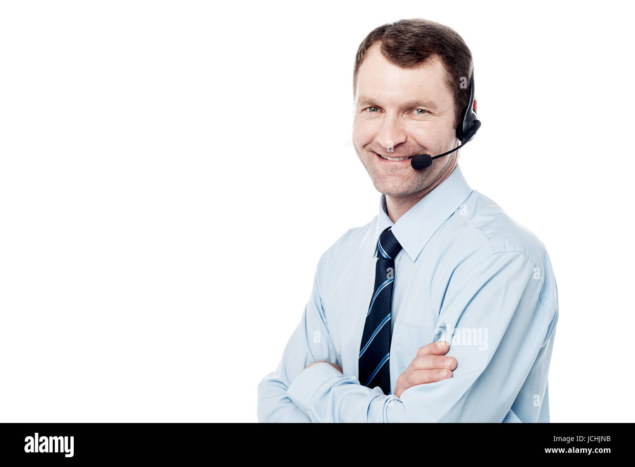 Customer service representative standing with crossed arms Stock Photo ...