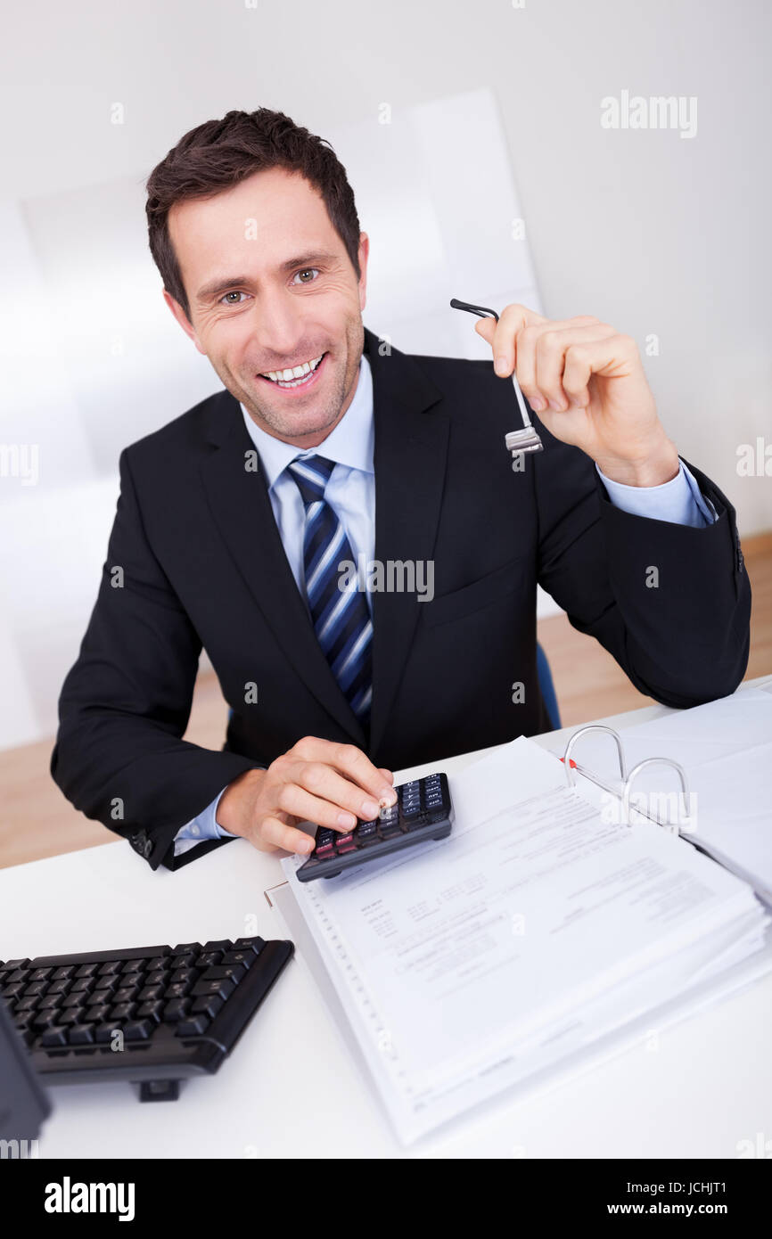 Portrait Of Happy Accountant At Workplace In The Office Stock Photo - Alamy