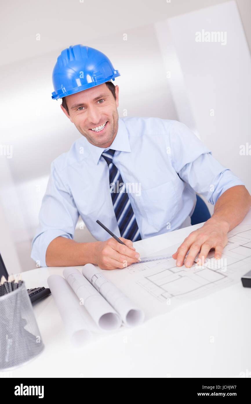 Portrait Of Architect With Blueprint In The Office Stock Photo - Alamy