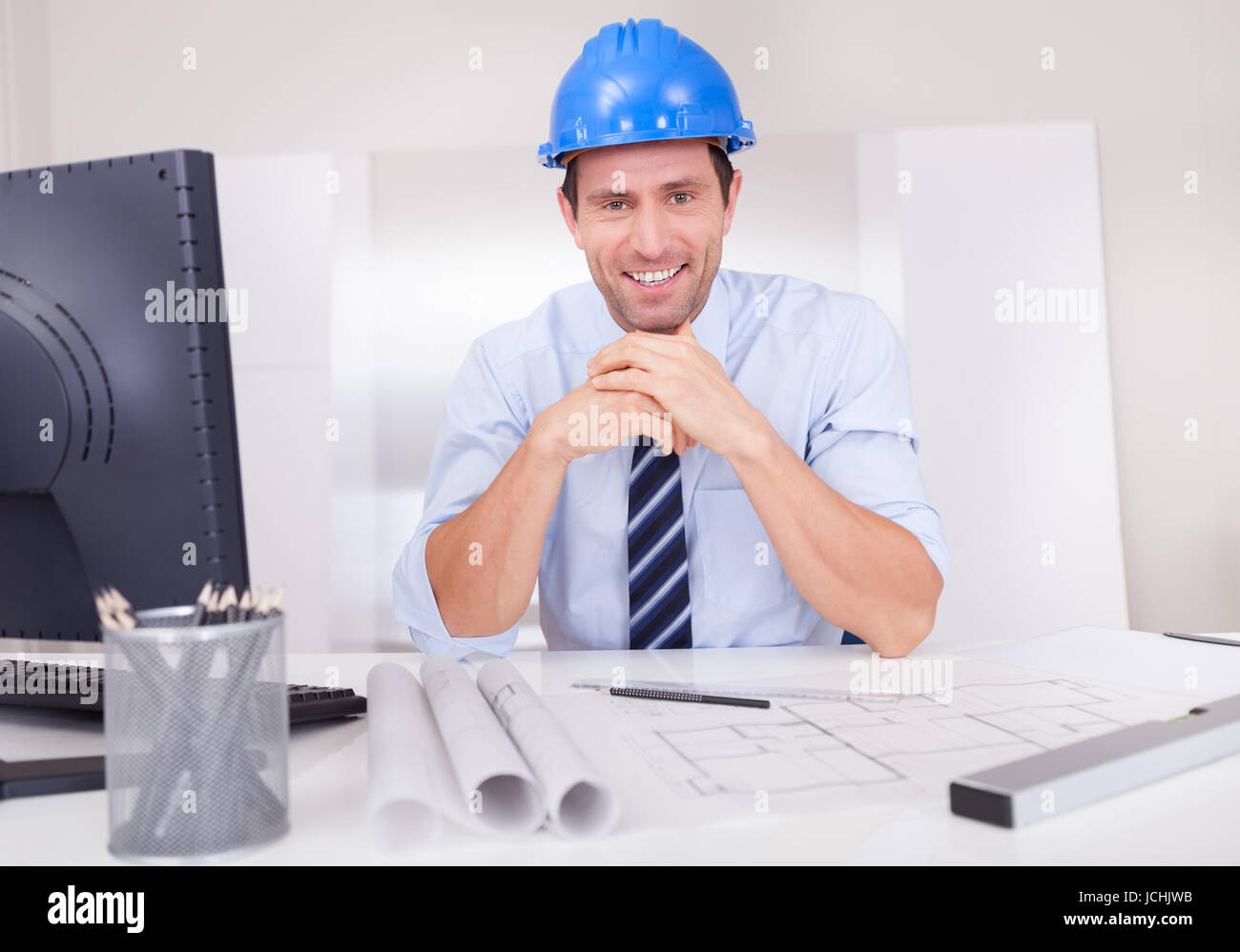 Portrait Of Architect With Blueprint In The Office Stock Photo - Alamy