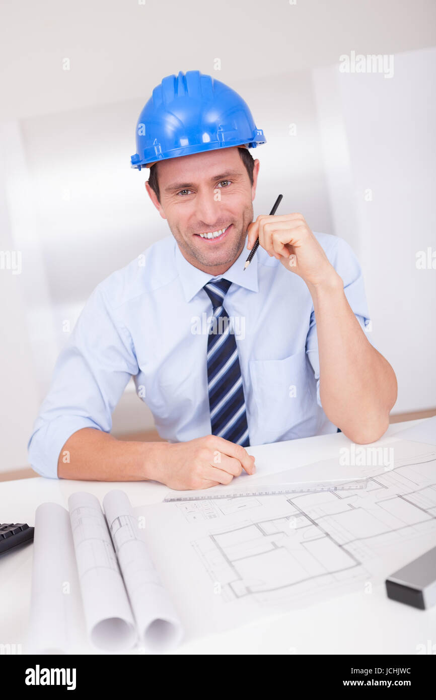 Portrait Of Architect With Blueprint In The Office Stock Photo - Alamy