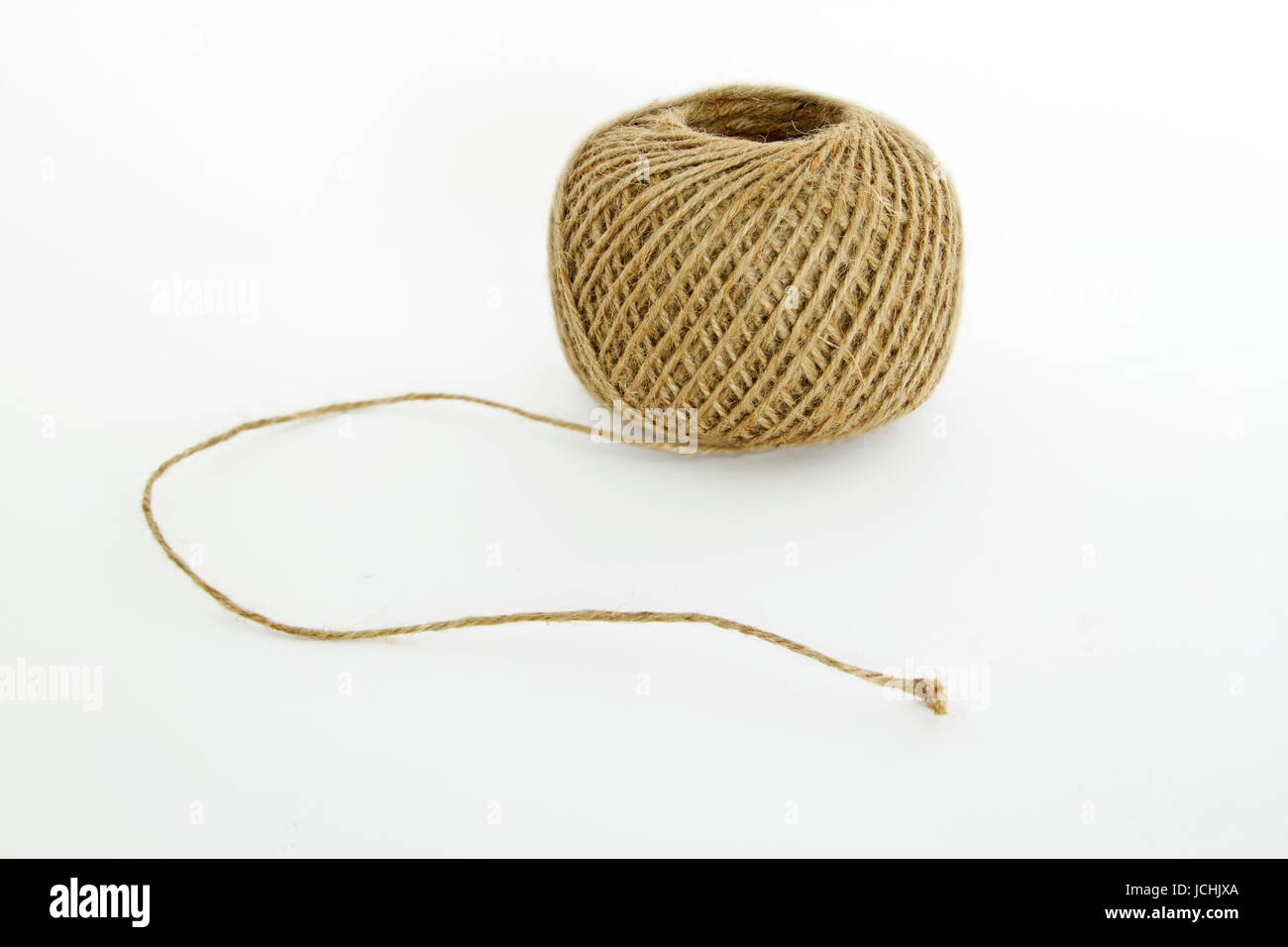 A ball of string isolated on white Stock Photo - Alamy