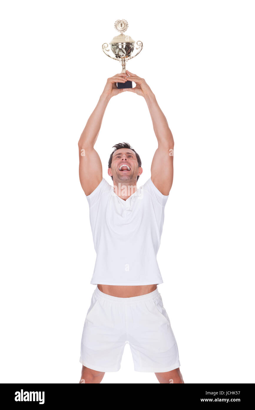 Portrait Of Young Man Holding Trophy Isolated On White Background Stock ...