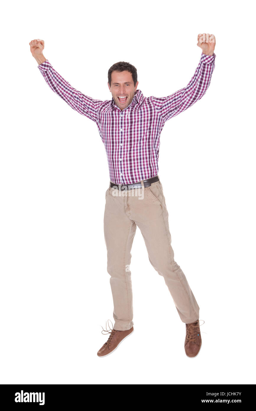 Portrait Of Young Man Cheering Isolated On White Background Stock Photo ...