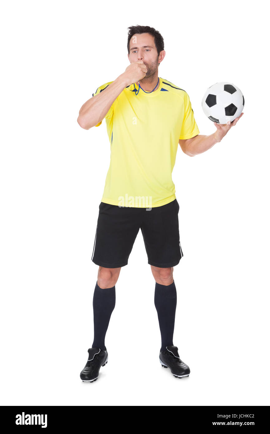 Soccer judge standing with ball. Isolated on white background Stock ...