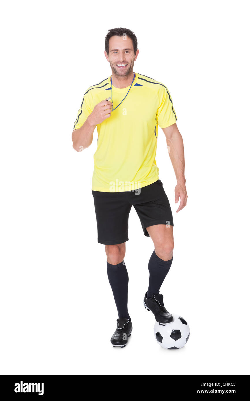 Soccer judge standing with ball. Isolated on white background Stock ...