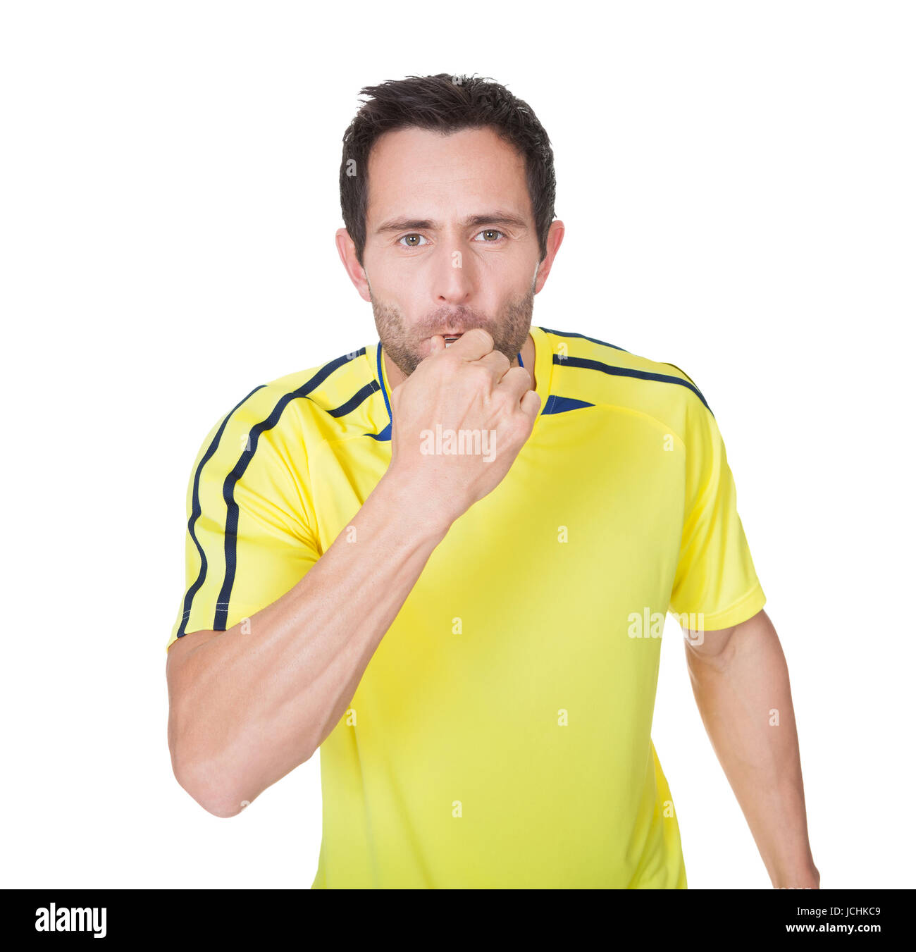 Soccer judge whistling. Isolated on white background Stock Photo - Alamy