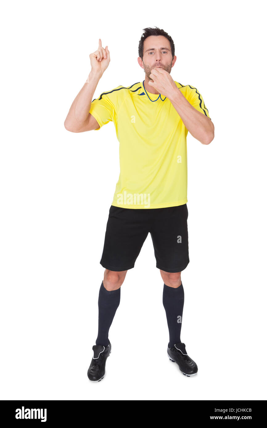 Soccer judge whistling. Isolated on white background Stock Photo - Alamy