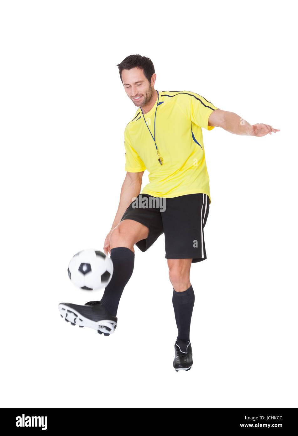 Soccer judge standing with ball. Isolated on white background Stock ...