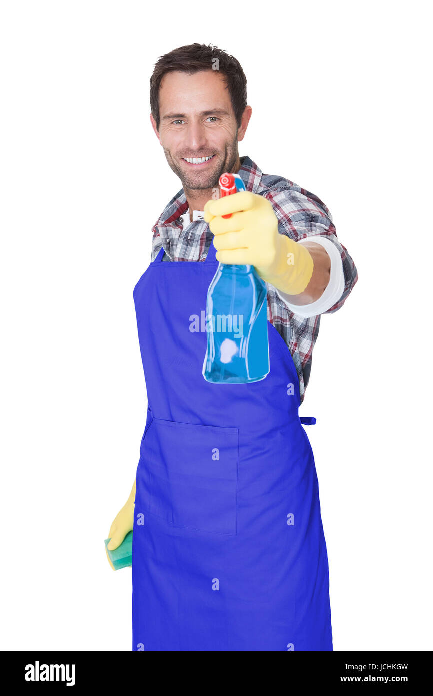 Portrait of a man with sponge and spray ready to clean windows ...