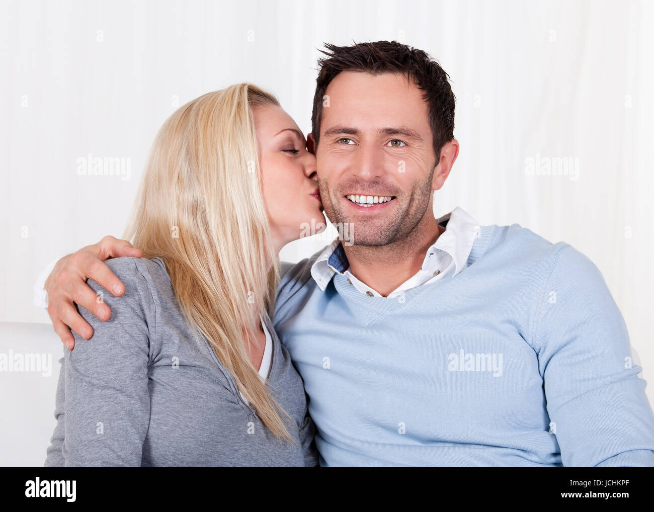 Romantic young couple expressing their love by rubbing noses as they ...